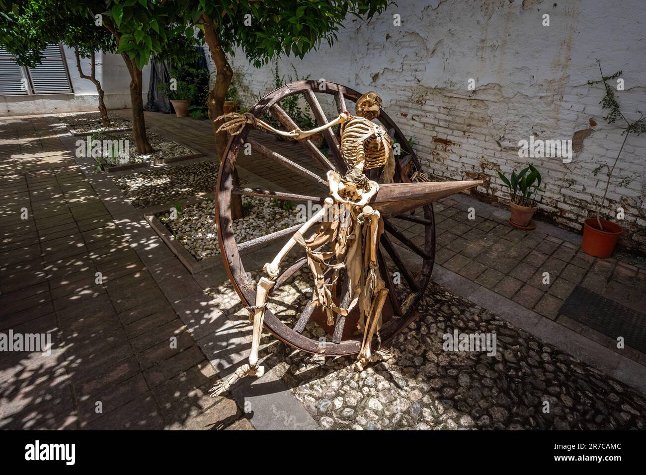 Skeleton in a Crushing Wheel at Inquisition Museum in the Palace of the ...