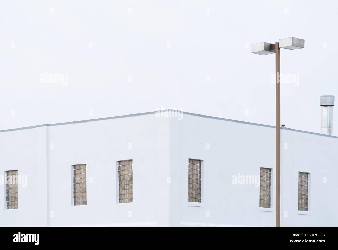 A minimalist white building with clean lines and an uncluttered ...