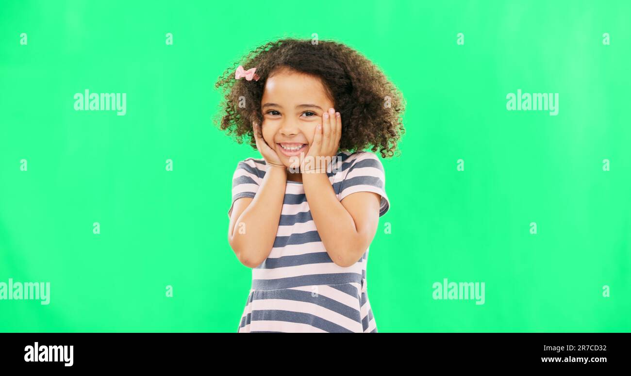 Cute, happy and the face of a child on a green screen isolated on a ...