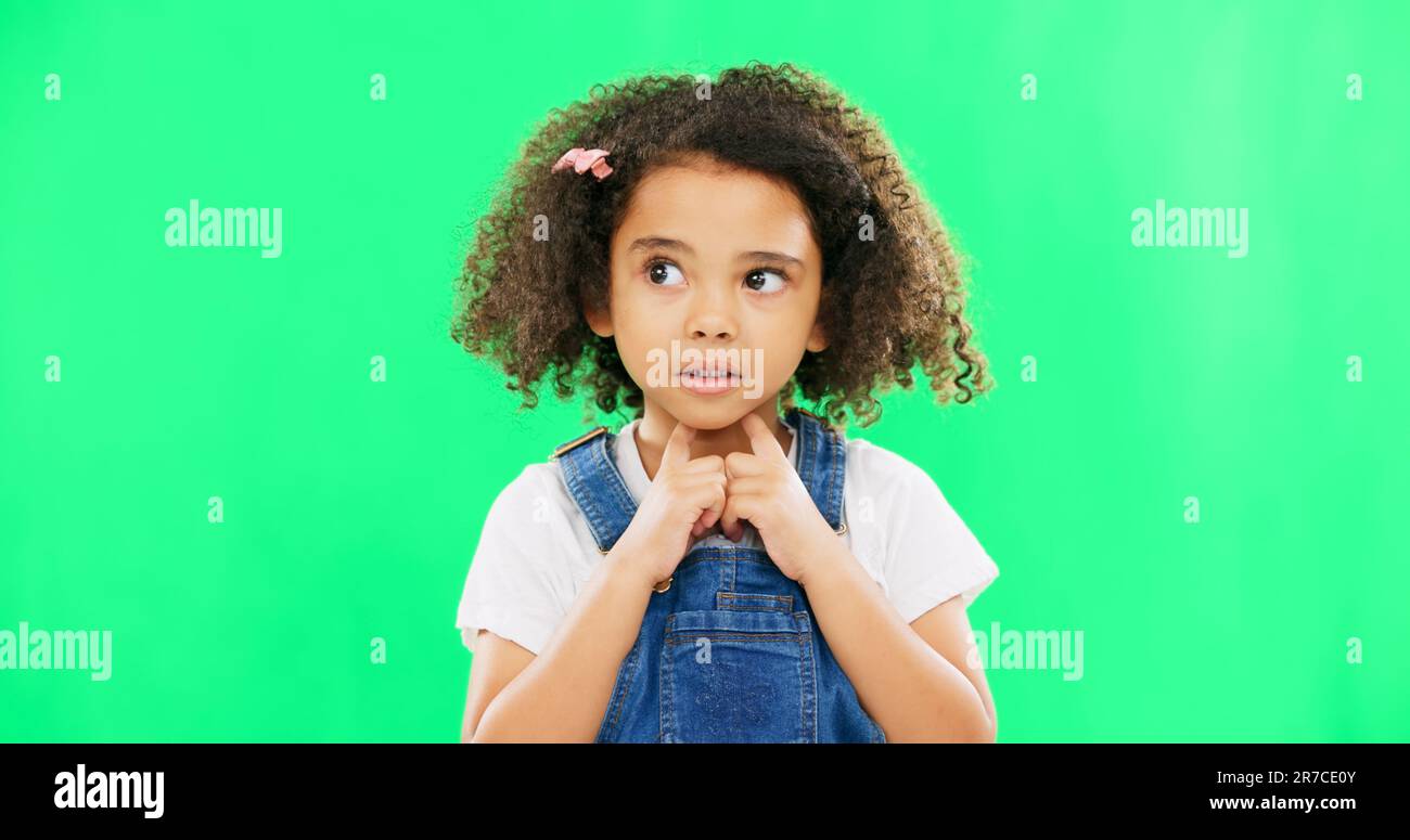 Child, thinking and nervous girl on green screen background with hands ...