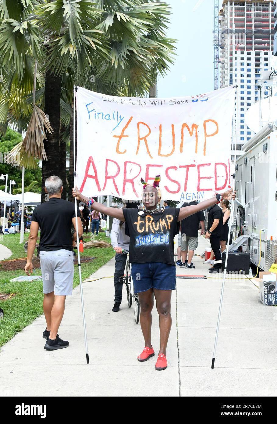 Miami, FL, USA. 13th June, 2023. Trump protester holding up signs at ...