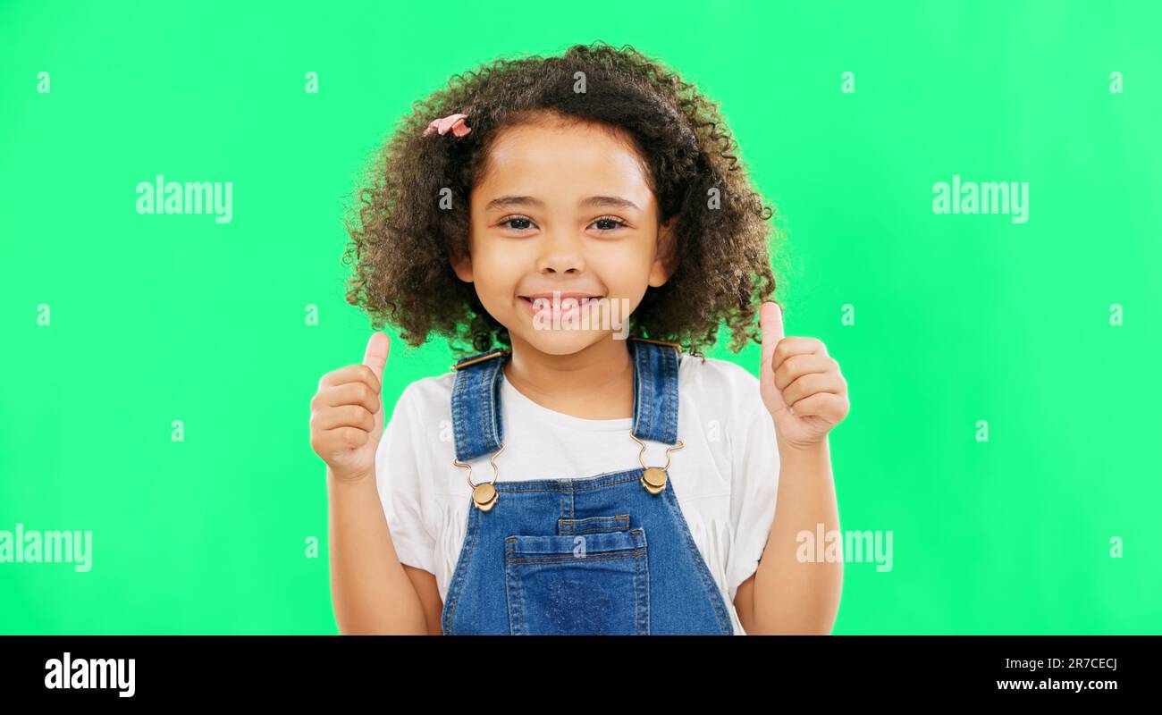 Cute, green screen and face of a child with a thumbs up isolated on a ...