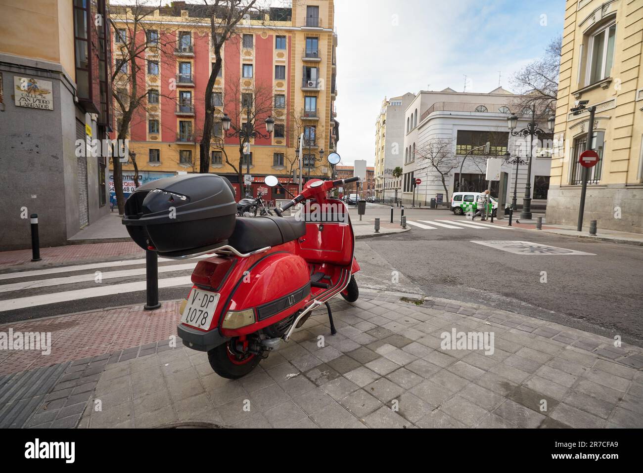 MADRID, SPAIN - CIRCA JANUARY, 2020: red scooter parked on street in ...