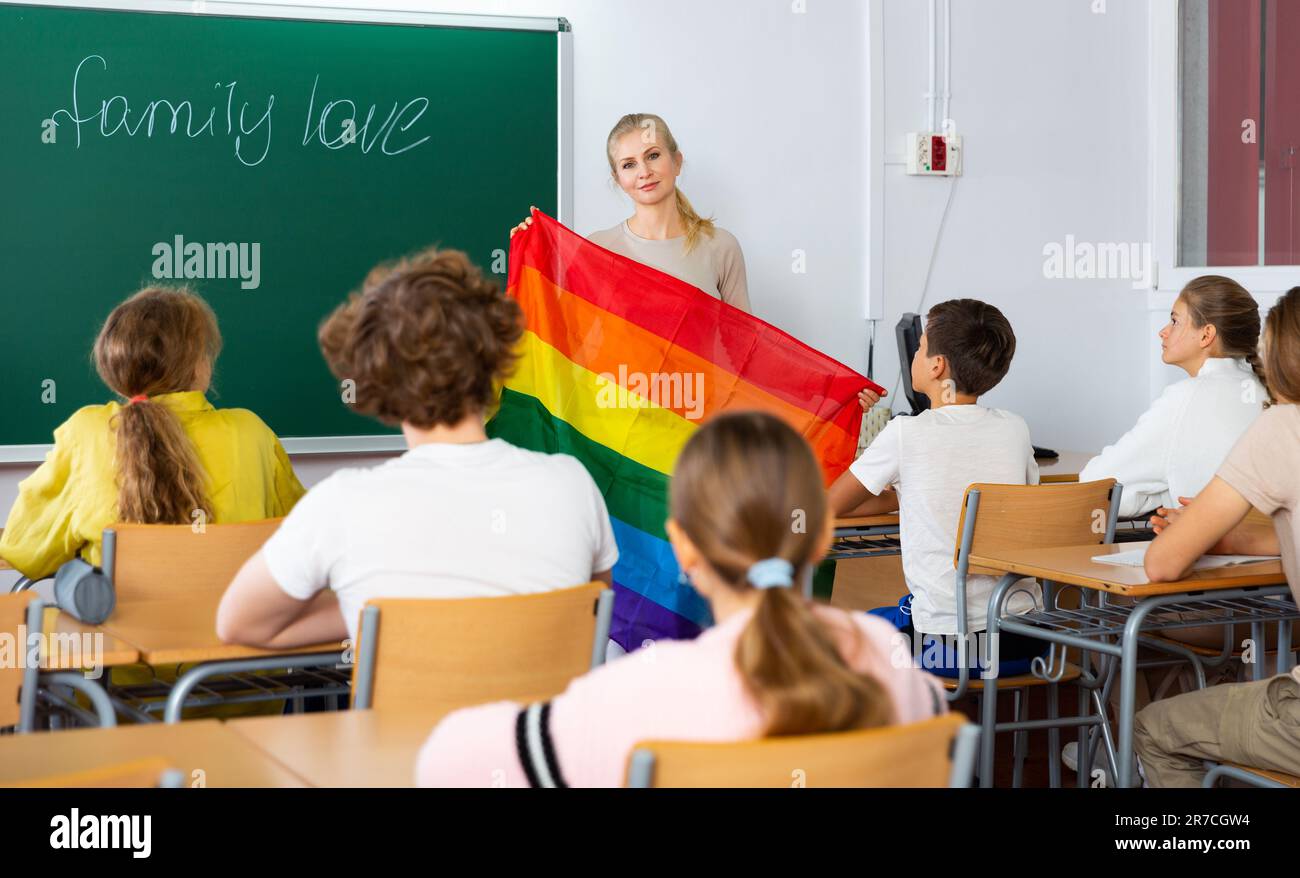 Teacher explaining lgbt theme to children during lesson Stock Photo - Alamy