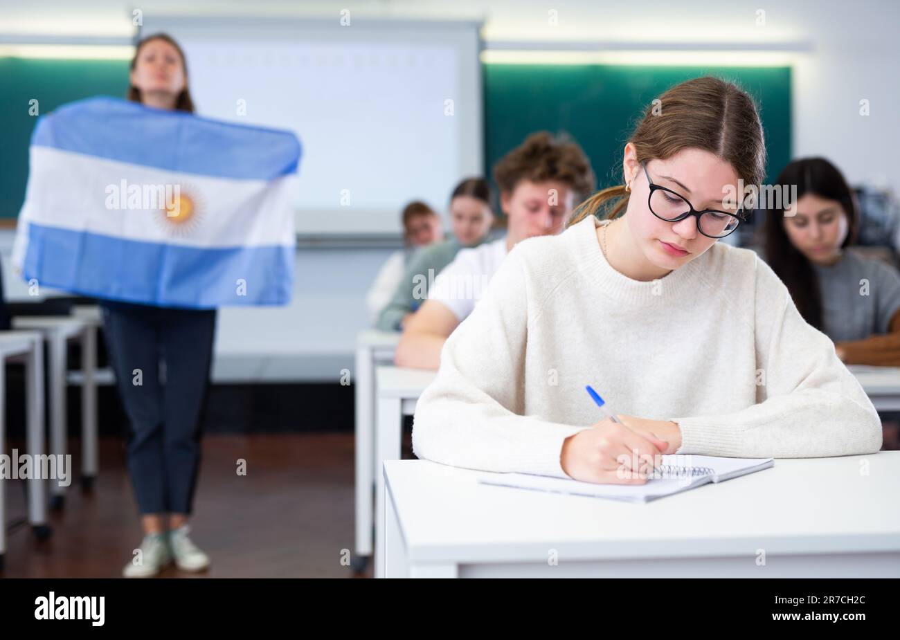 Young girl student diligently studies at school Stock Photo - Alamy