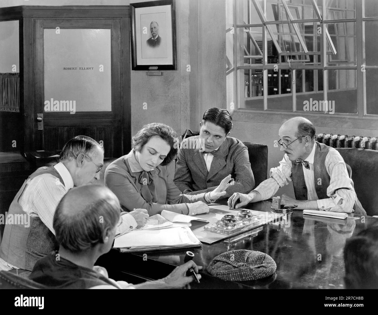 Hollywood, California: 1925. A business meeting scene from the silent ...