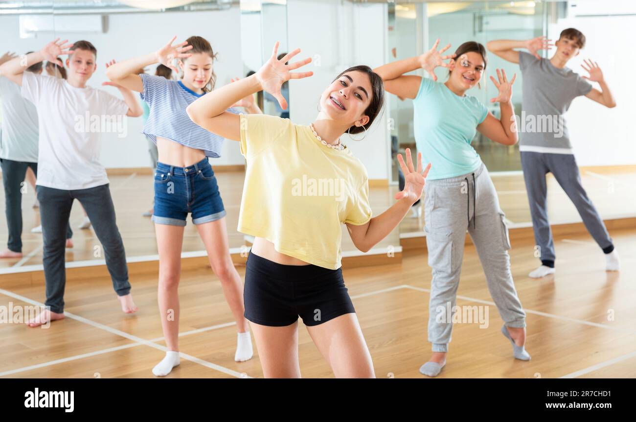 Teenage girl exercising during group dance class Stock Photo - Alamy