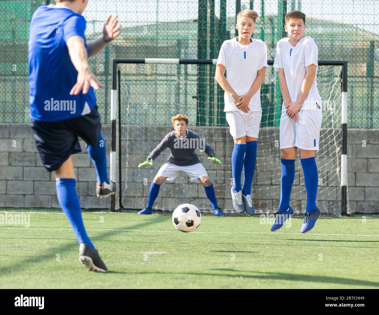 Two youth teams play football Stock Photo - Alamy