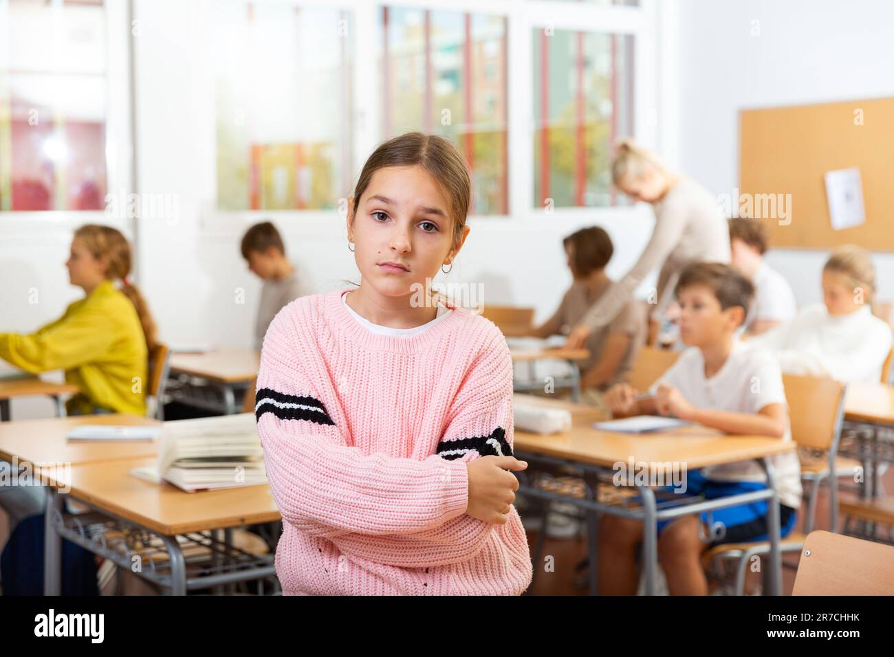 Portrait of sad young girl in school Stock Photo - Alamy