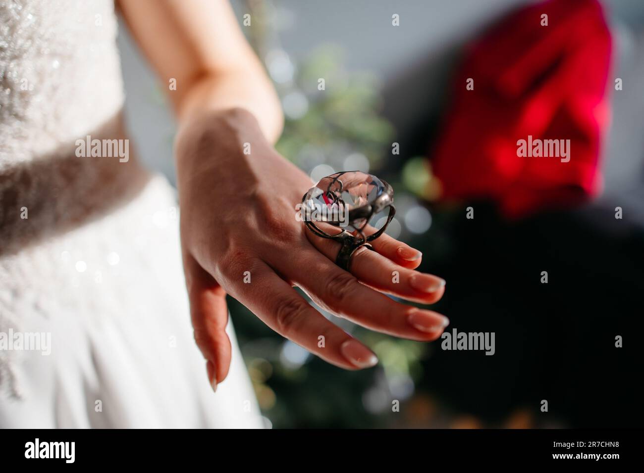 A huge ring with a big diamond on the bride's hand Stock Photo - Alamy