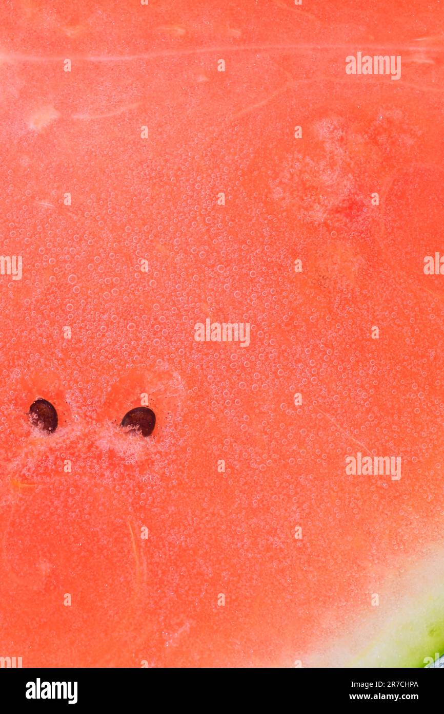 Slice of ripe watermelon in water. Close-up of watermelon in liquid ...