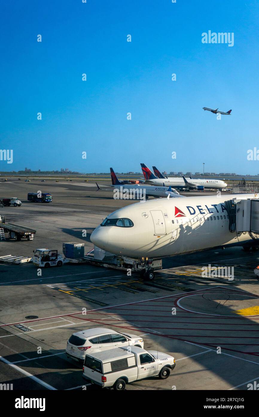 Queens, NY – USA – June 1, 2023 Vertical view of Delta passenger jets ...