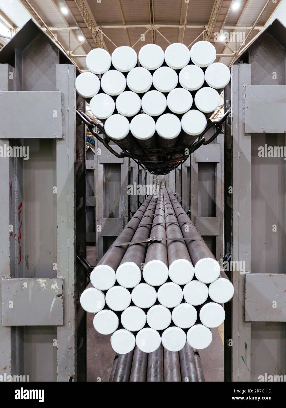 Packs of rolled metal bars on the shelves Stock Photo - Alamy