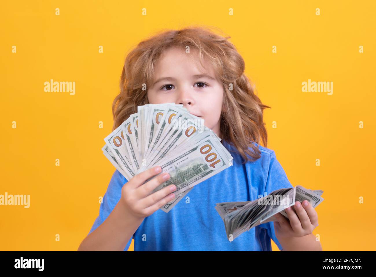 Happy rich kid boy with money dollars cash Stock Photo - Alamy
