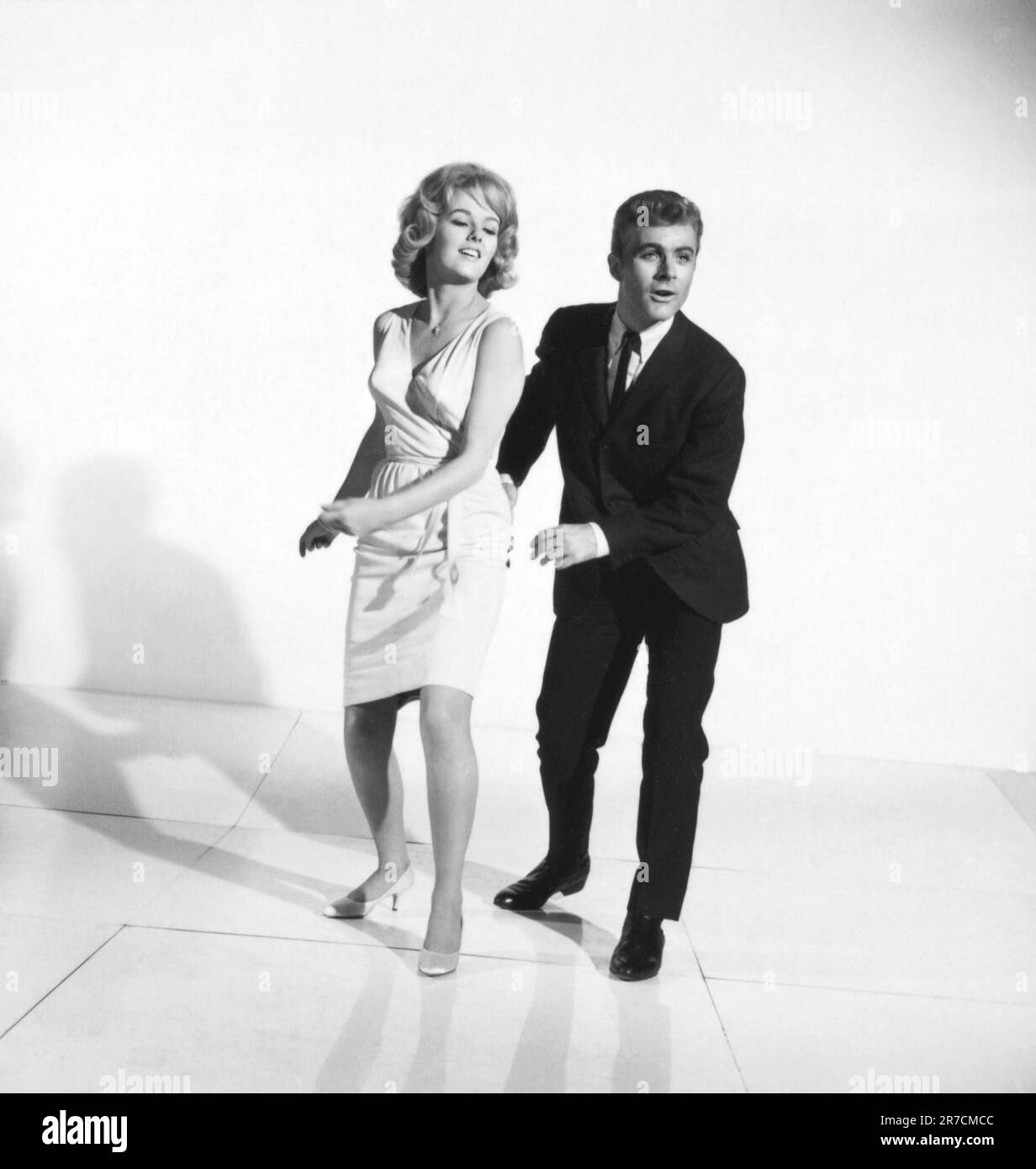 United States: c. 1961 A photograph of a couple demonstrating how to ...