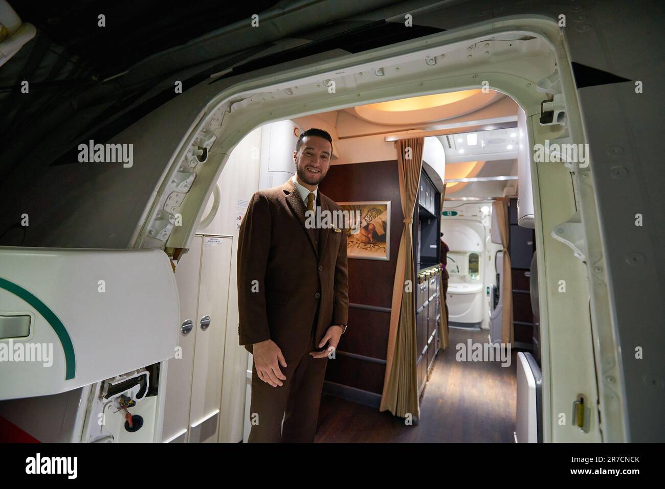 ABU DHABI, UAE - CIRCA JANUARY, 2020: crew member meet passengers in ...