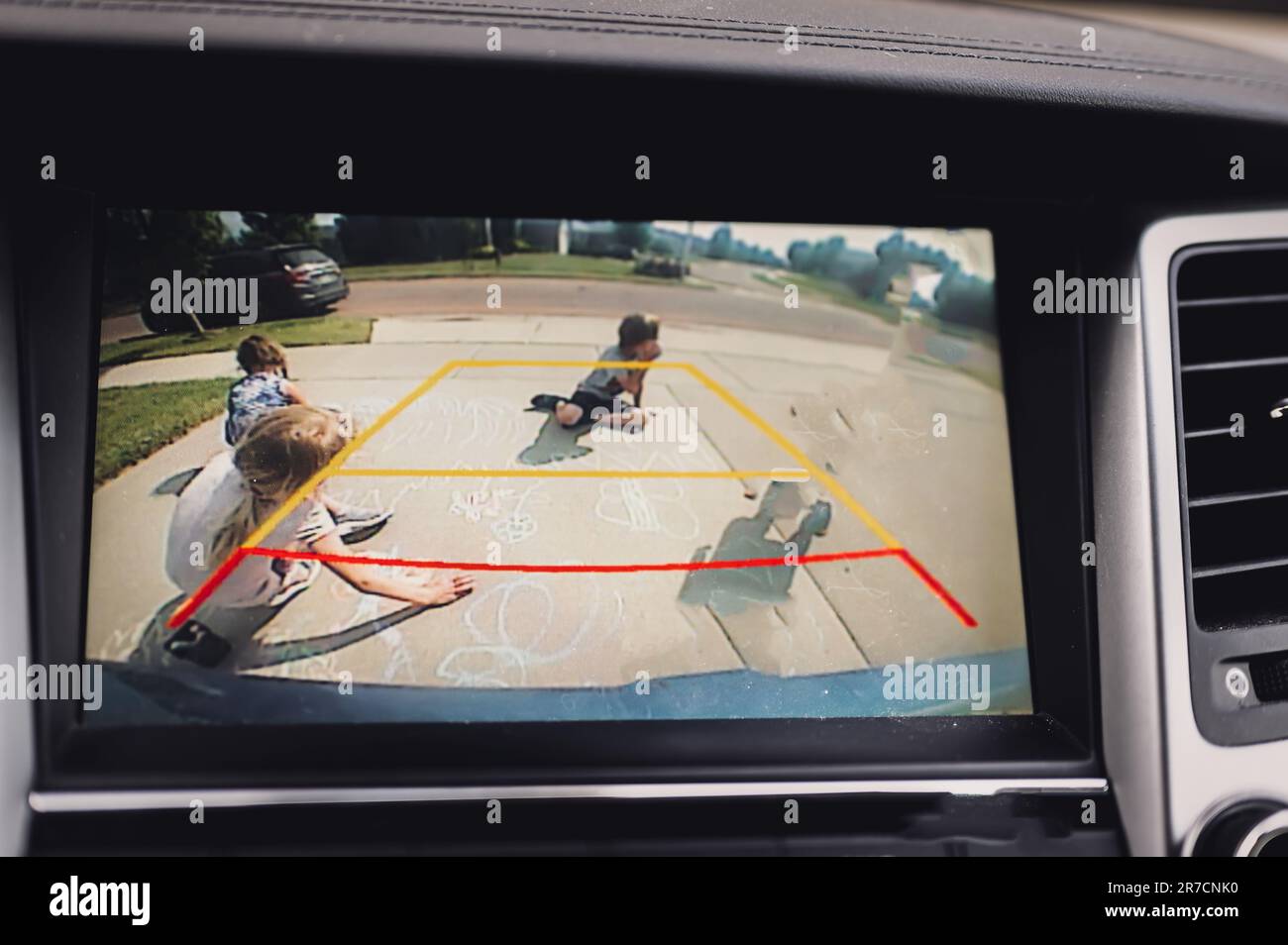 Children seen in a rear view backup camera drawing with chalk Stock ...