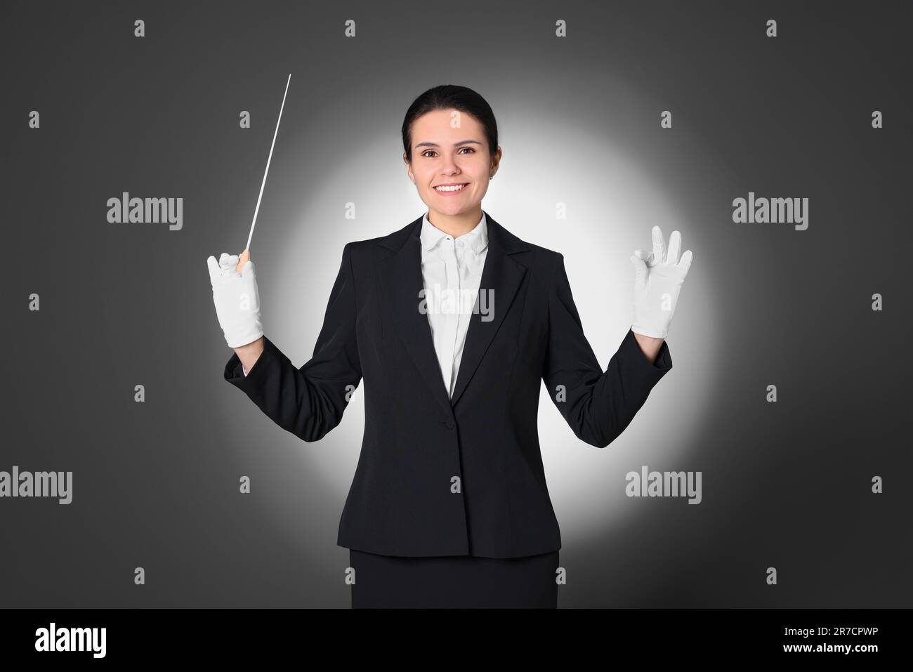 Happy professional conductor with baton on grey background Stock Photo ...