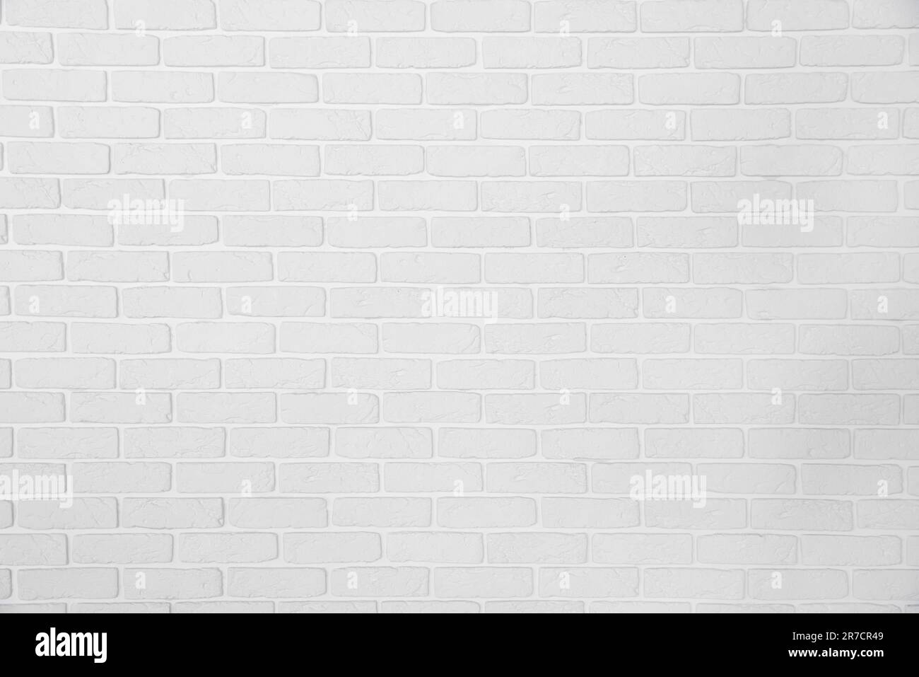 Decorative white bricks with tile leveling system on wall Stock Photo ...