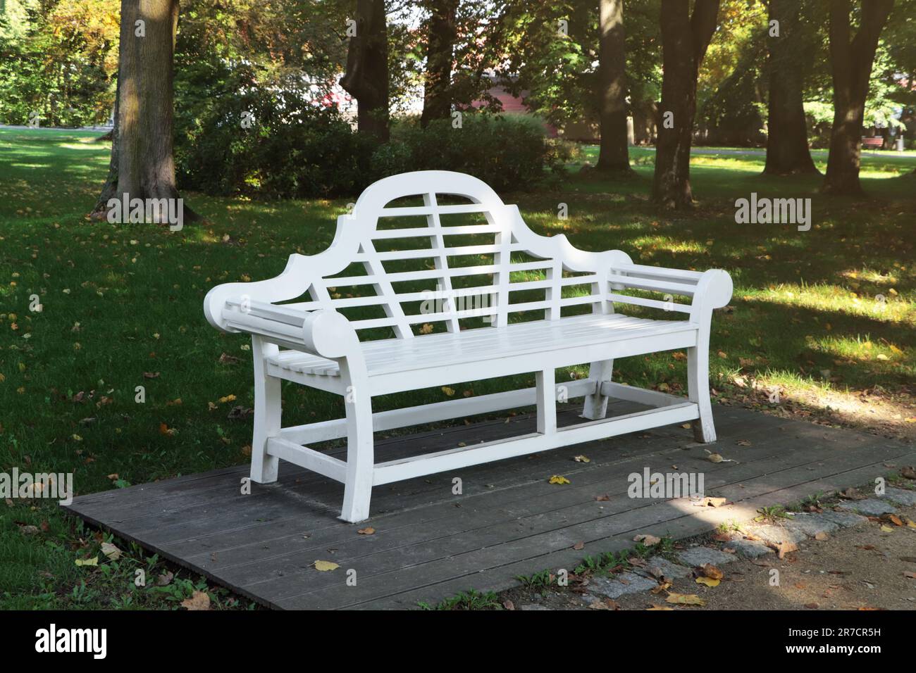 Beautiful white bench in public city park Stock Photo - Alamy