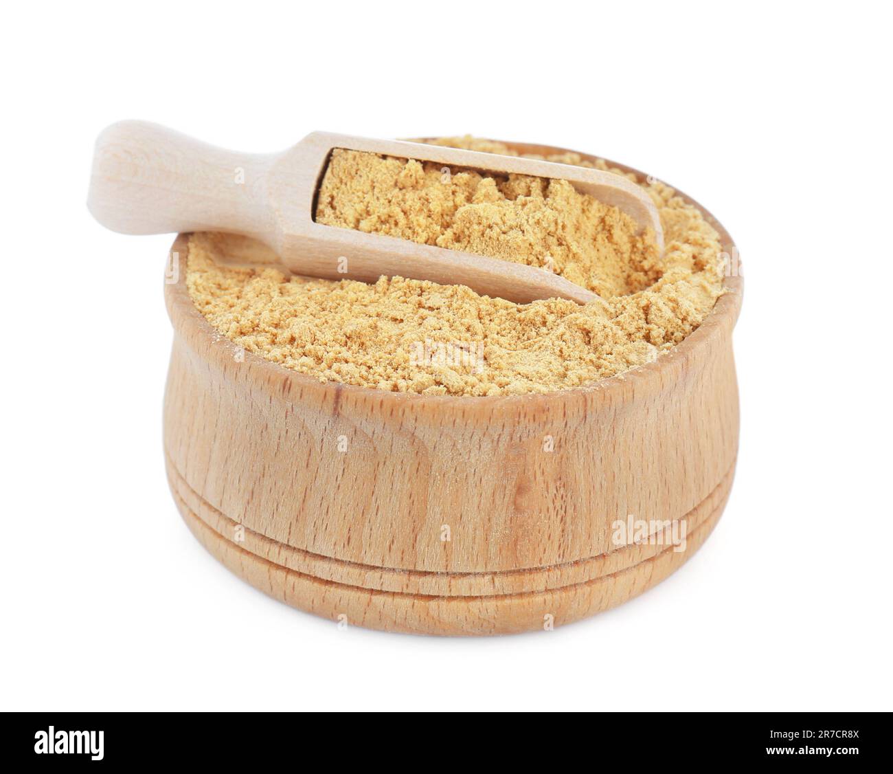 Wooden scoop and bowl with aromatic mustard powder on white background ...