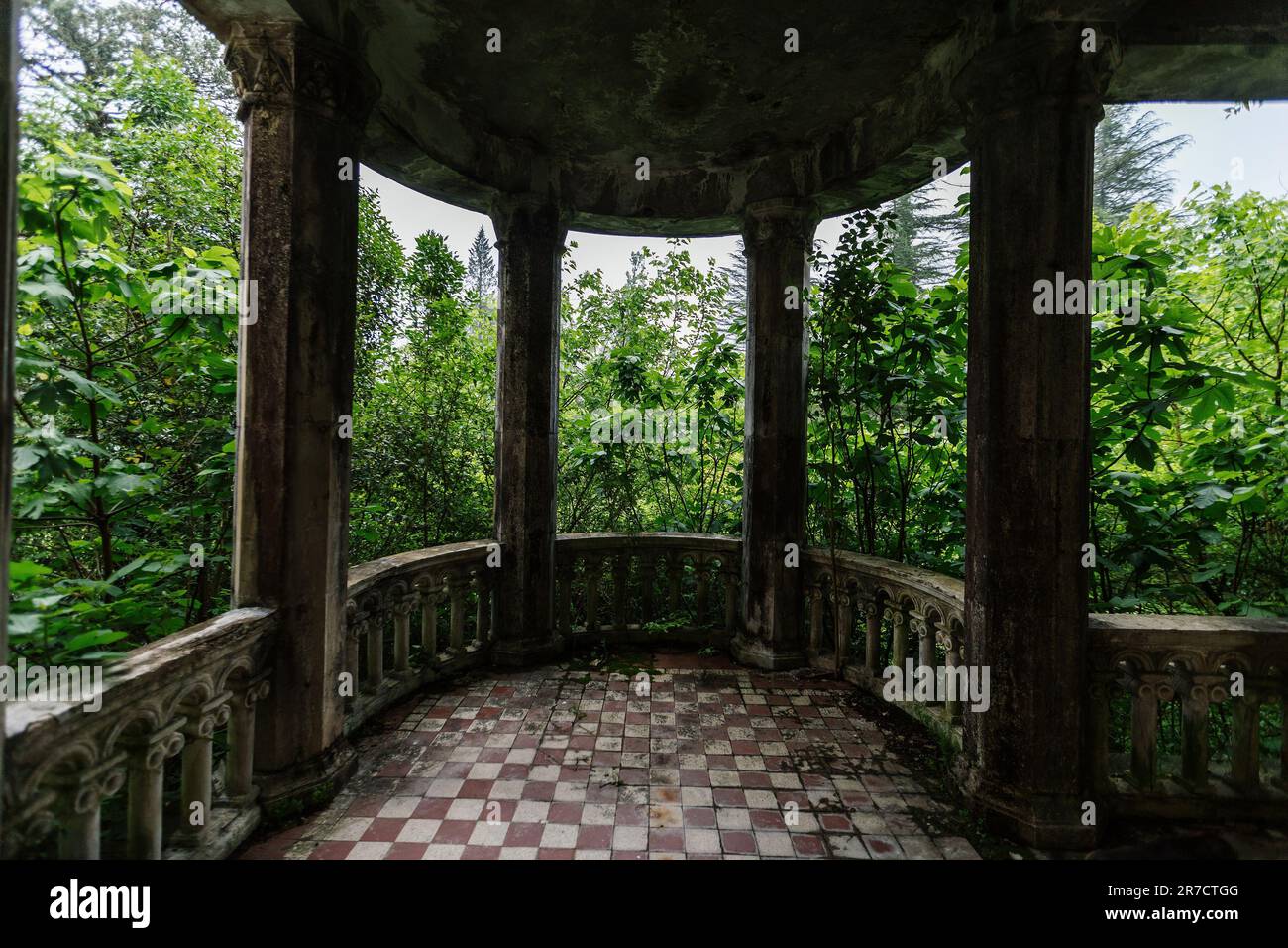 Old overgrown balcony in old abandoned mansion Stock Photo - Alamy