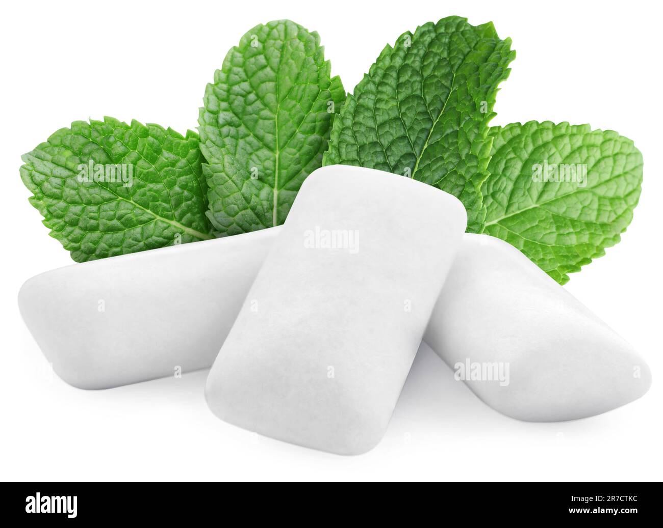 Menthol chewing gum pillows and mint leaves on white background Stock ...
