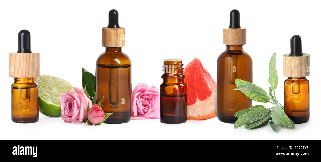 Many different essential oils and ingredients on white background ...