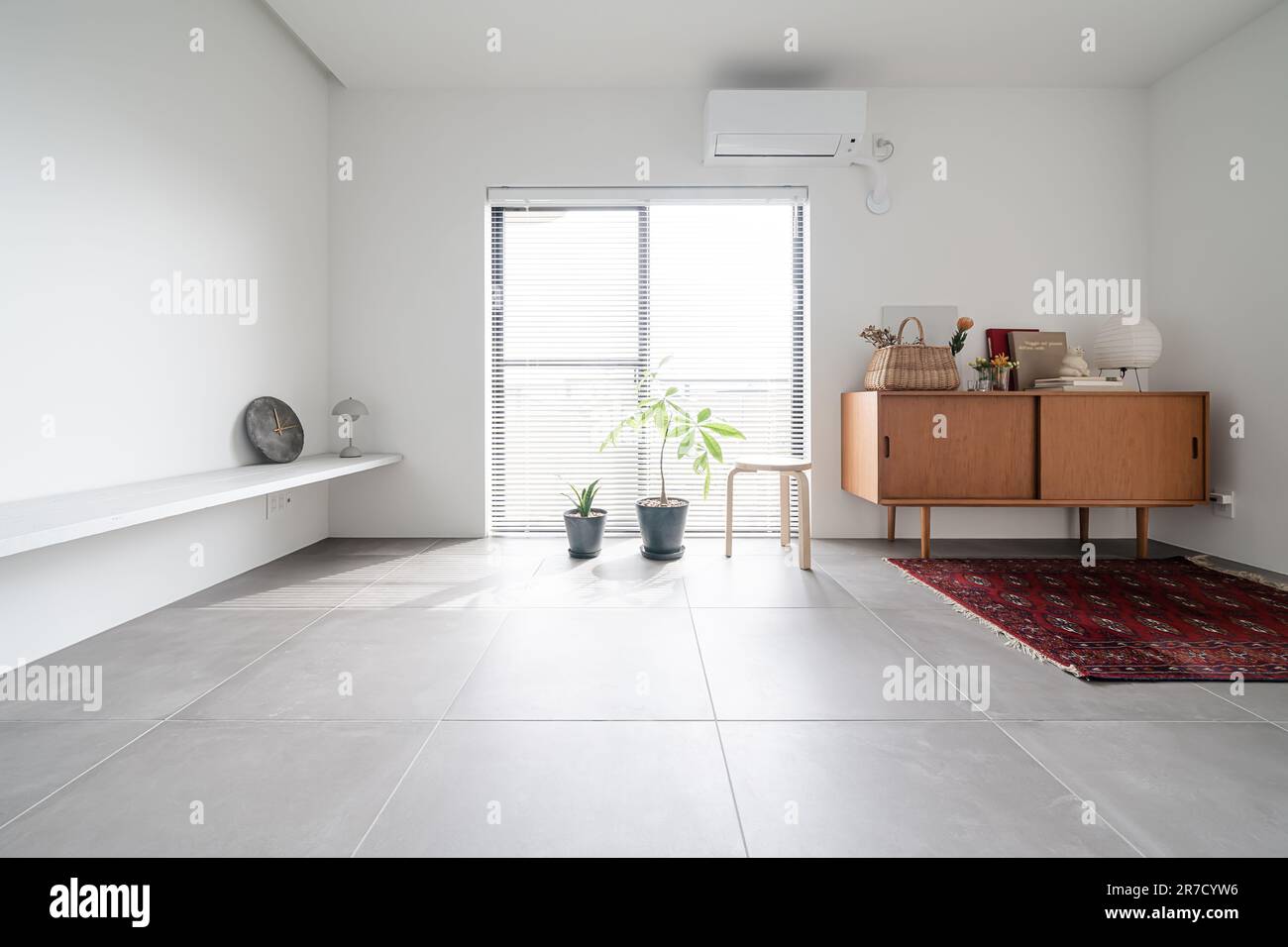 Simple modern style living room with white tone Stock Photo - Alamy