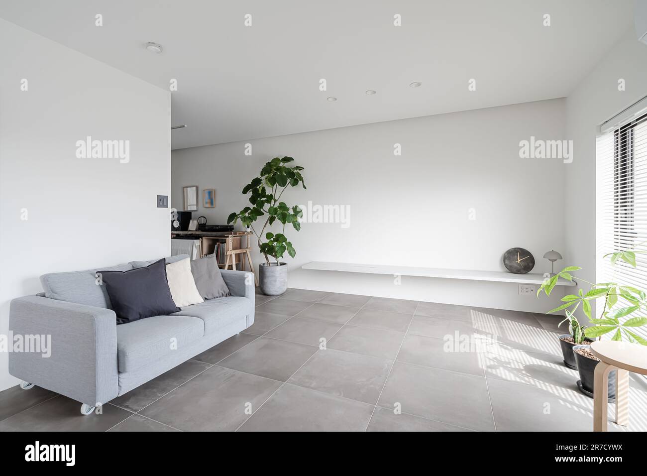 Simple modern style living room with white tone Stock Photo - Alamy