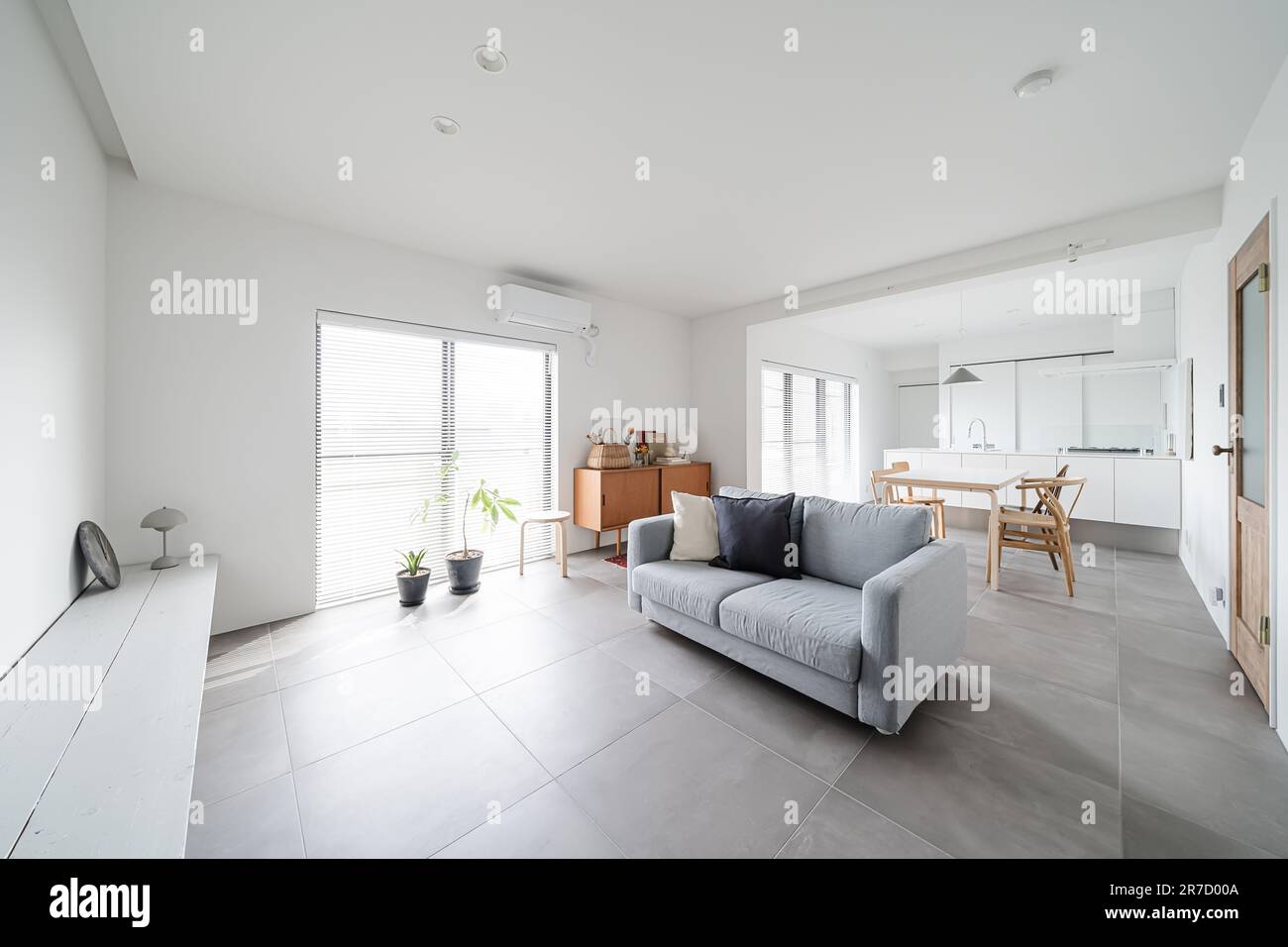 Simple modern style living room with white tone Stock Photo - Alamy