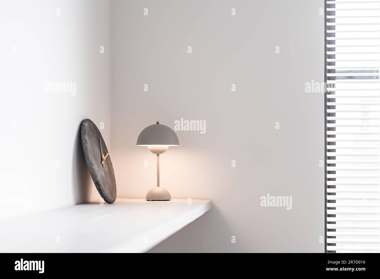 Clock and light stand on the shelf Stock Photo - Alamy