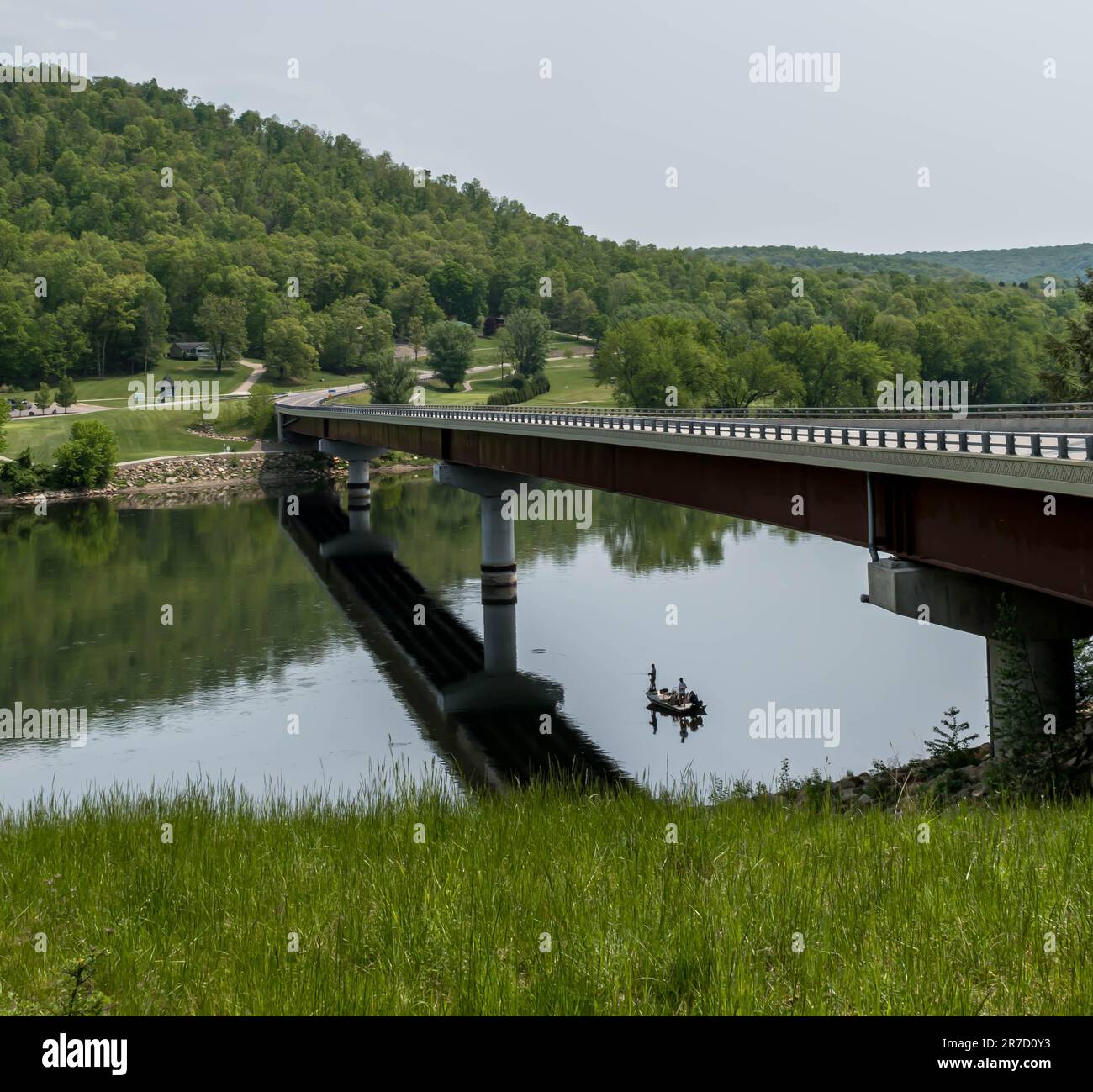 Two men in a bass boat fishing on the Allegheny River under the Hunter ...