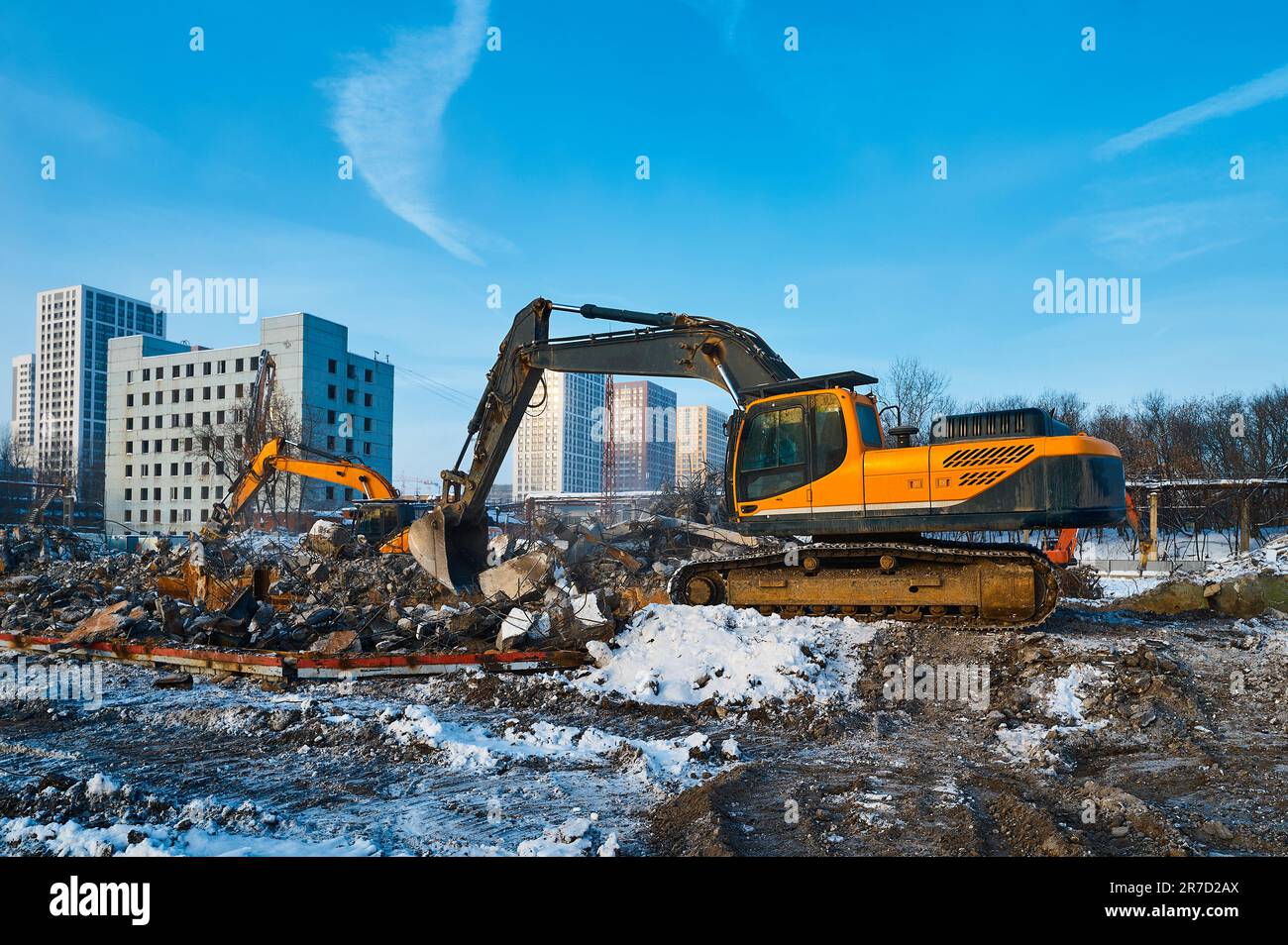 Bucket on excavator collects construction debris on site Stock Photo ...