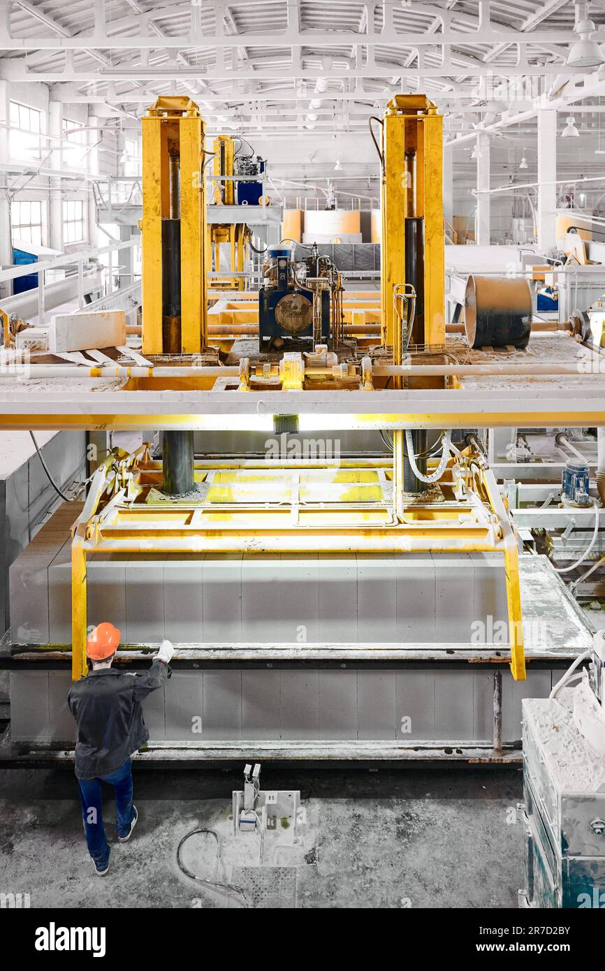 Workers in factory shop for production of concrete blocks Stock Photo ...