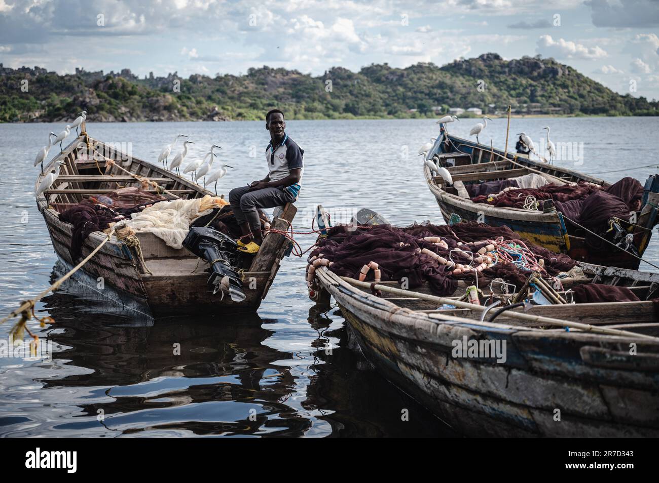 Mwanza. 10th June, 2023. A fisherman sits on a fishing boat on the ...