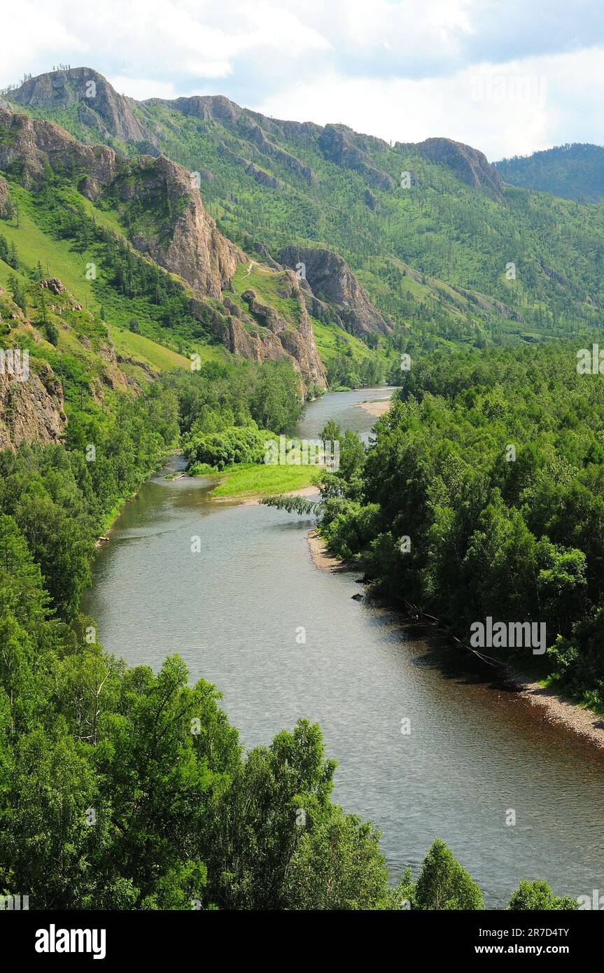 The turn of the bed of a beautiful river flowing through the summer ...