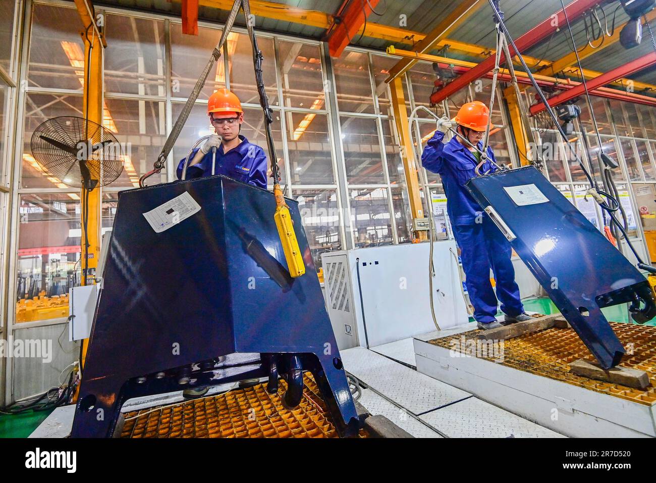 QINGZHOU, CHINA - JUNE 15, 2023 - Workers assemble at a production ...