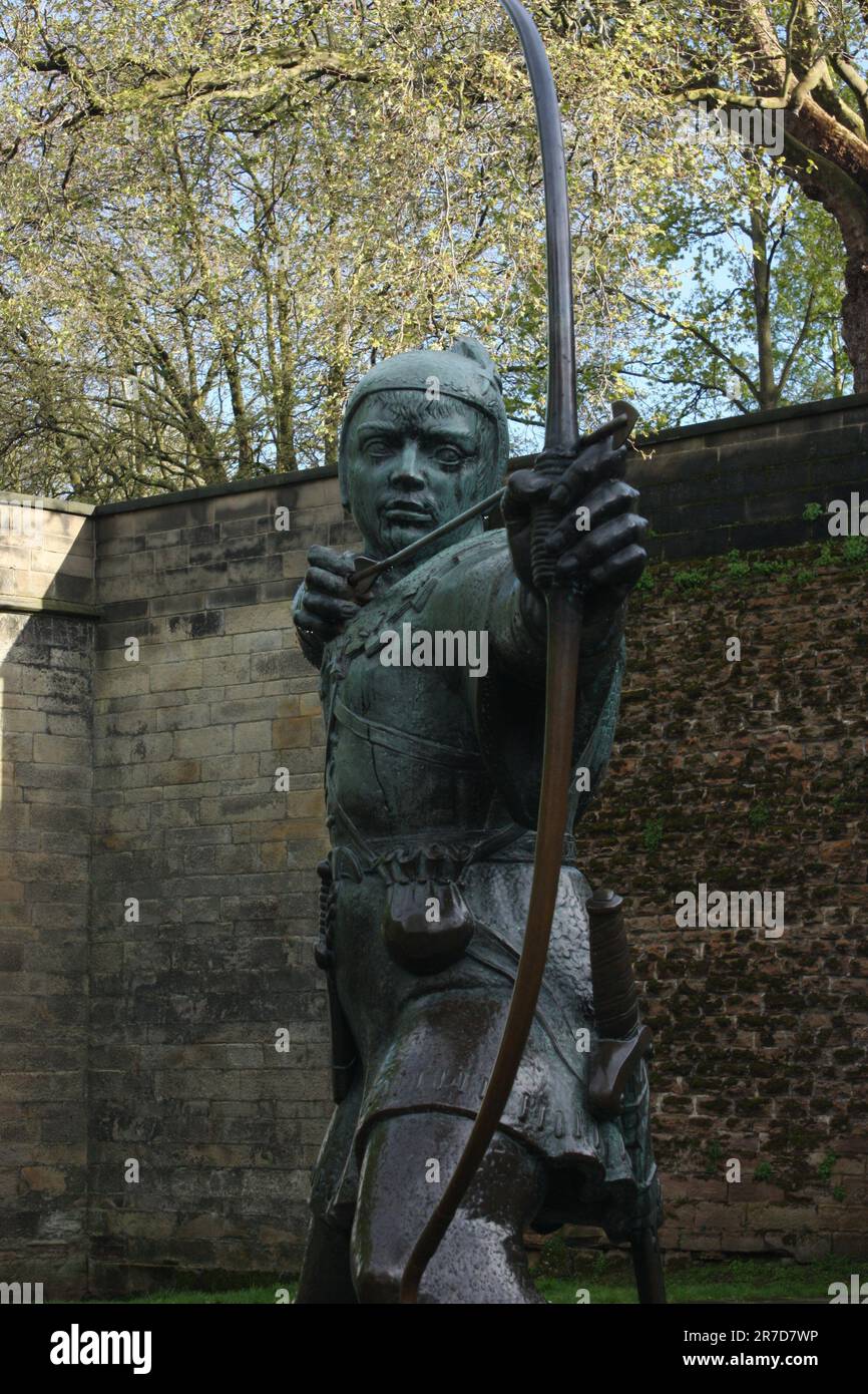 The statue of Robin Hood near the walls of the castle in Nottingham ...
