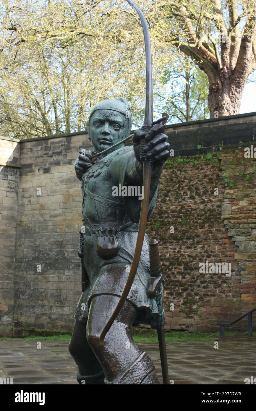 The statue of Robin Hood near the walls of the castle in Nottingham ...