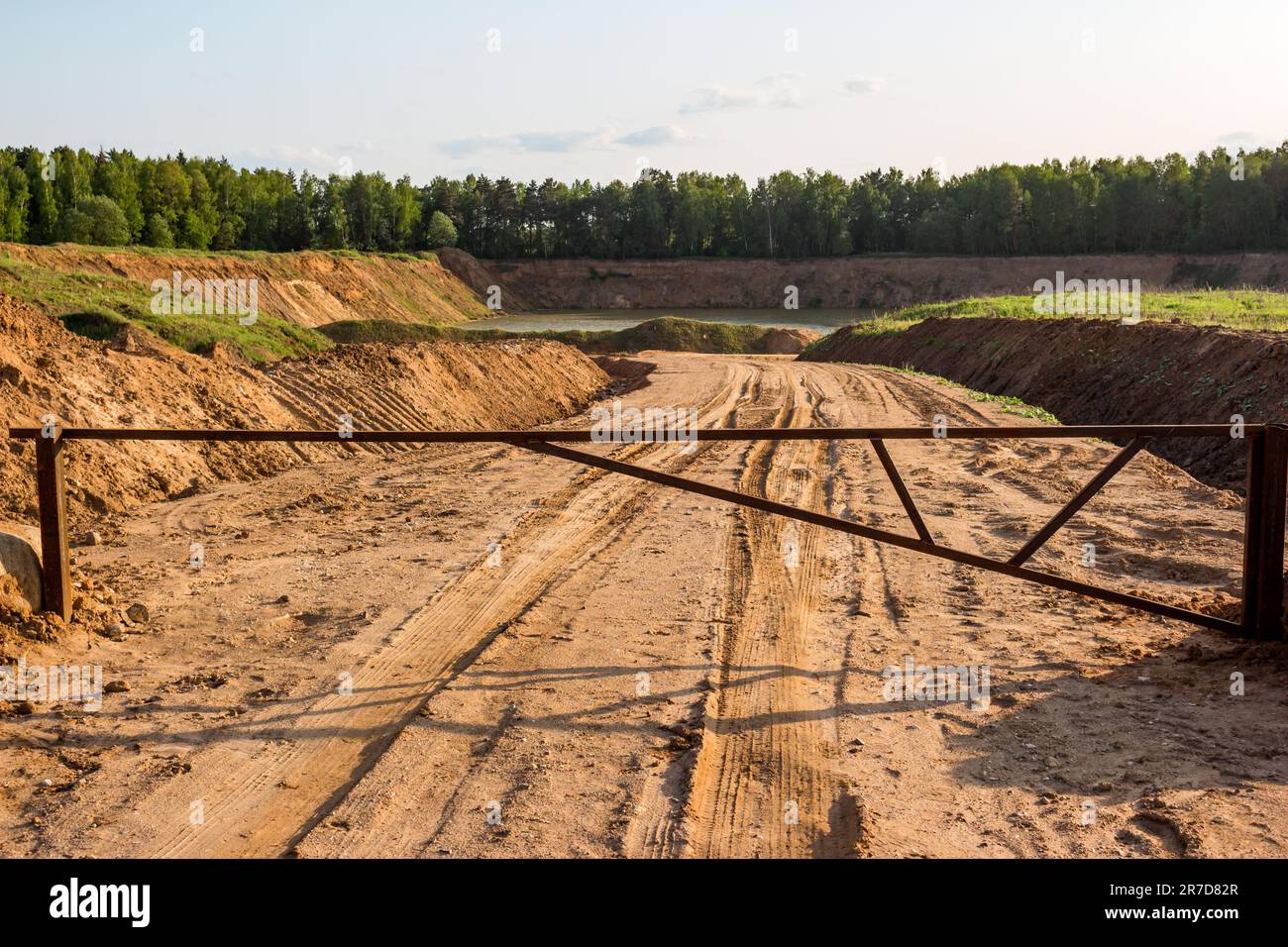 Barrier blocking a dirt road in the countryside Stock Photo - Alamy