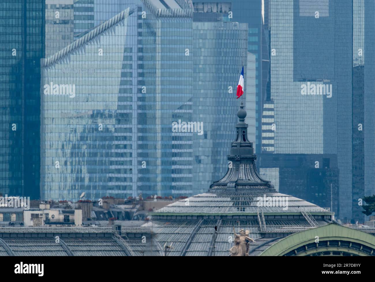 6 May 2023 Paris, France. The French flag is prominently displayed atop ...