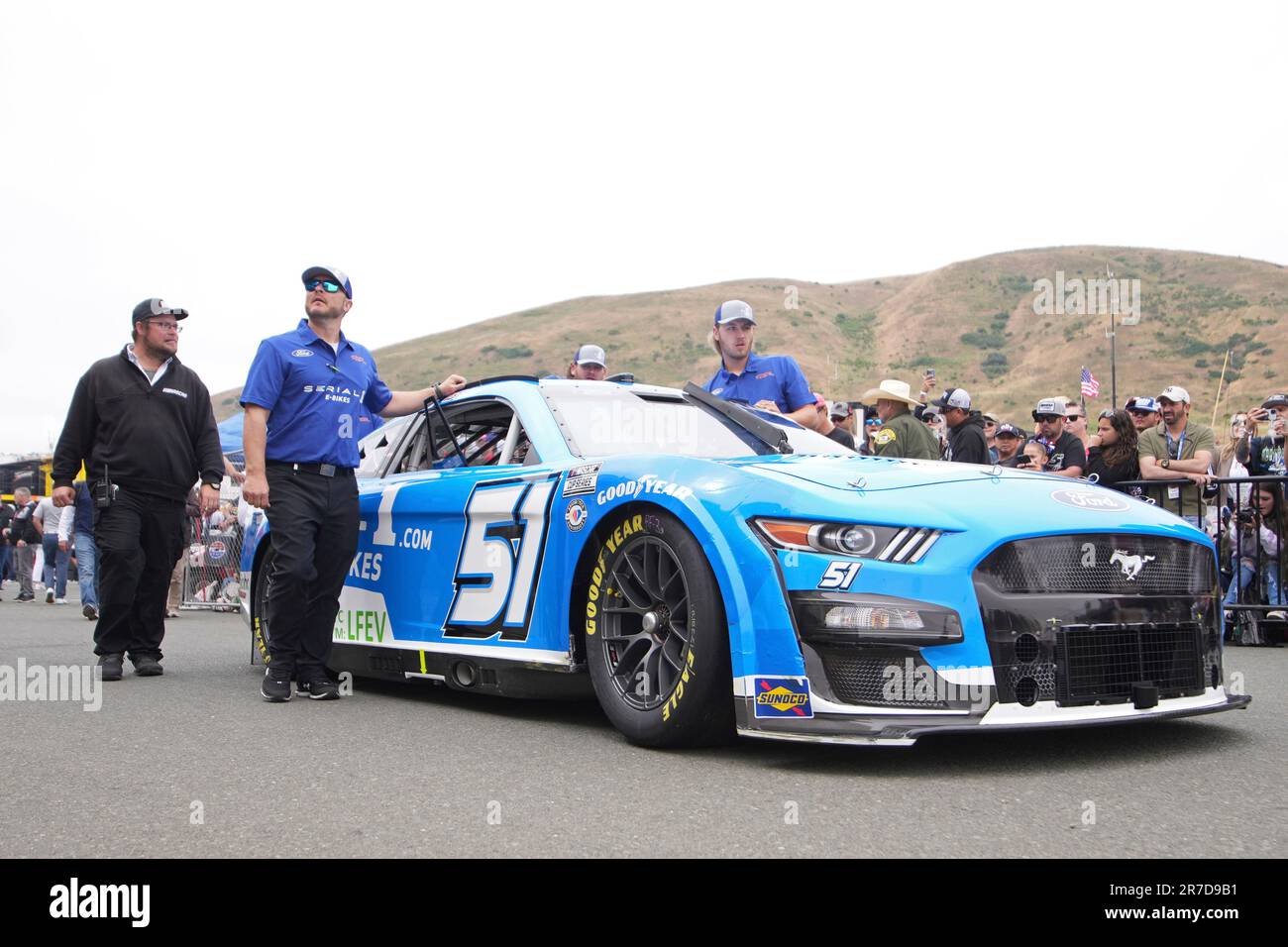 Crew members push the car of Todd Gilliland (51) before a NASCAR Cup ...