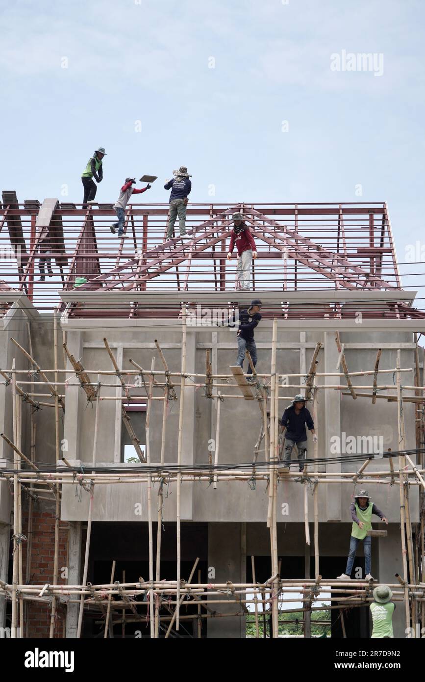 The Roofer working on roof structure of building on real estate ...