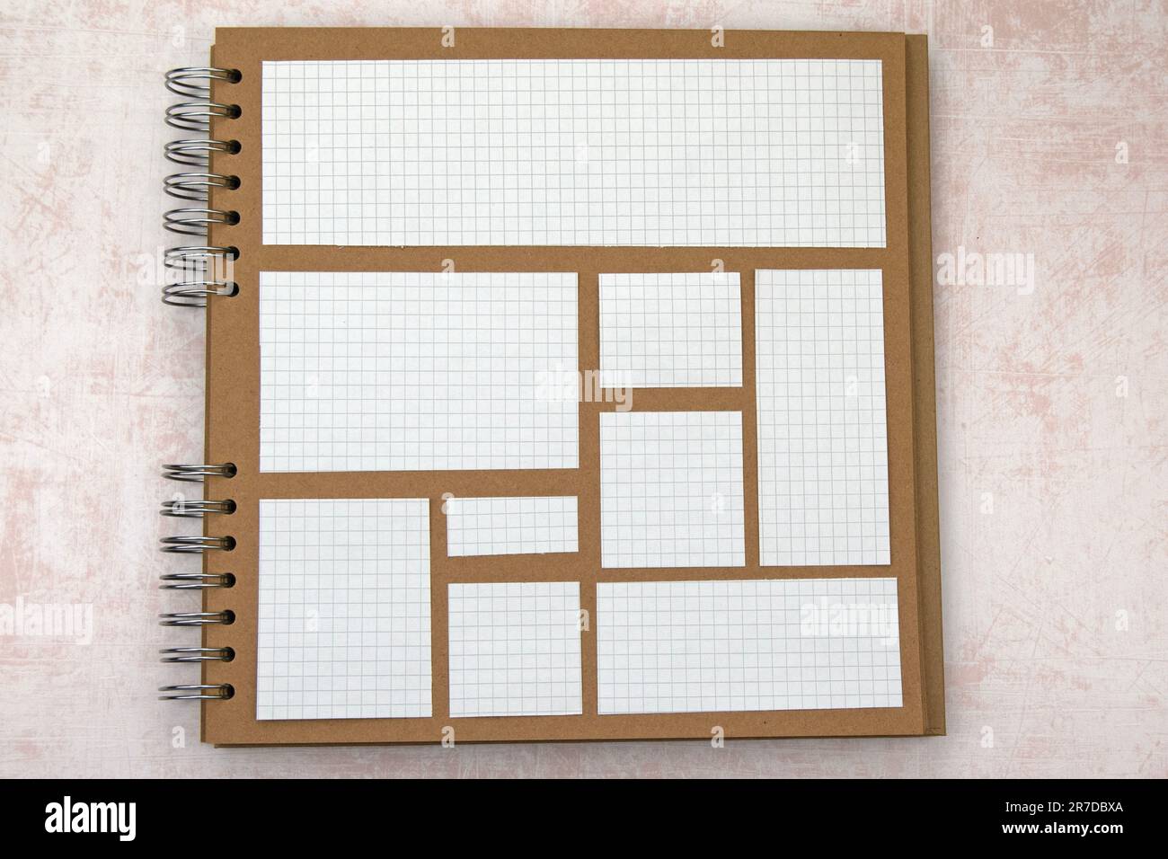 Square lined paper cut outs on ring bound scrap book. Different sizes ...