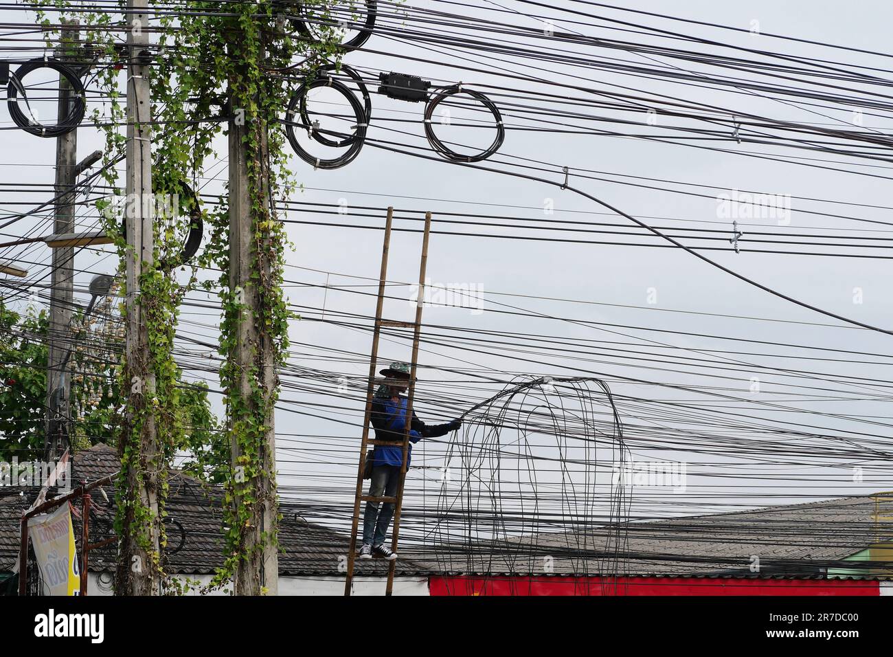 Technician cutting cable and Electricians are dismantling the wiring ...