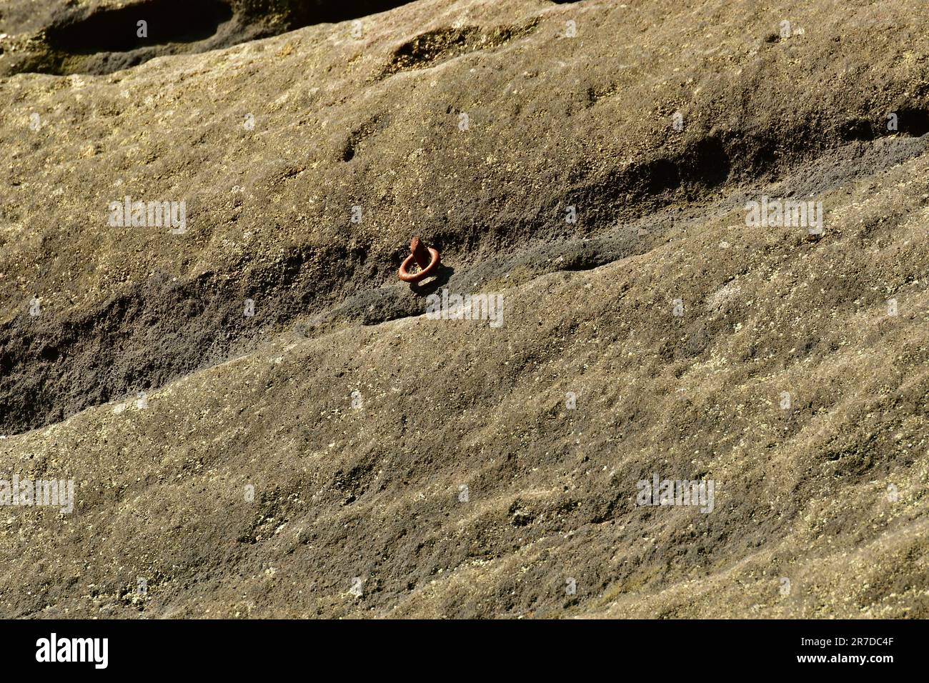 Rock wall Sandstone with anchor ring of steel vertical Stock Photo - Alamy