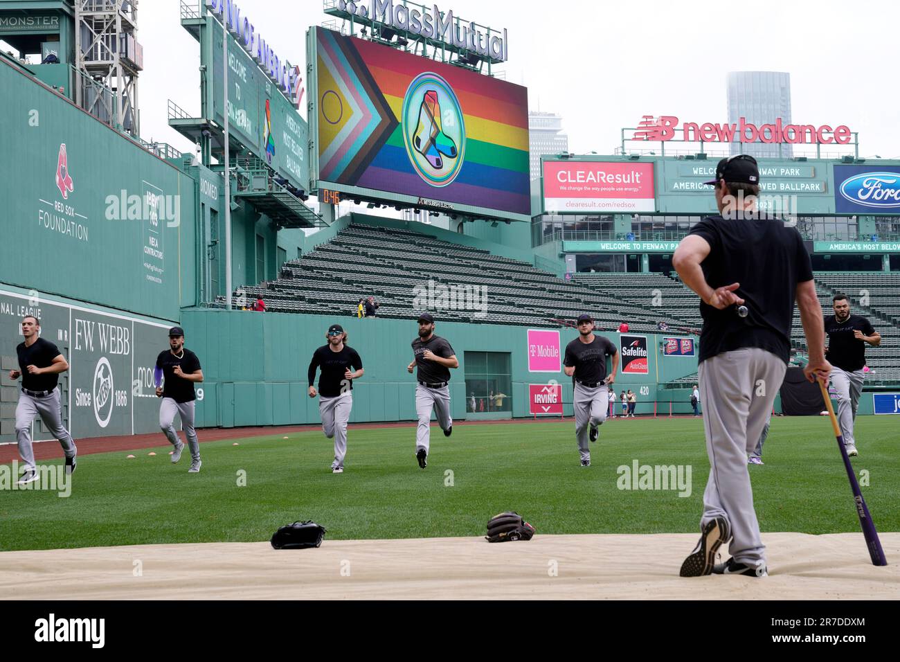 A rainbow adorned Boston Red Sox logo is displayed on the center field ...