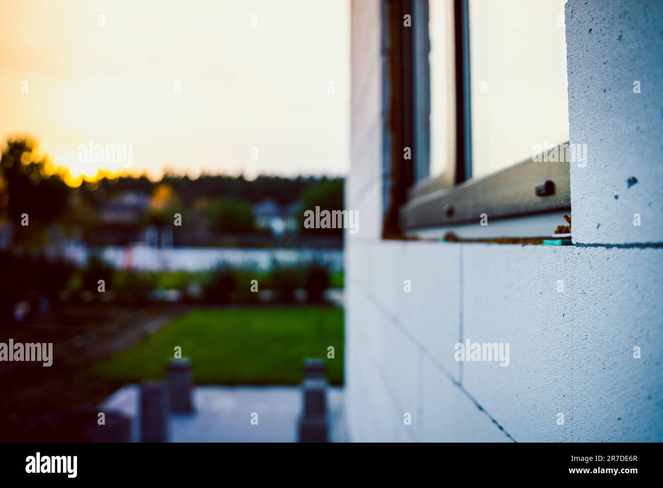 Gas block brickwork with a plastic window in the foreground and a ...