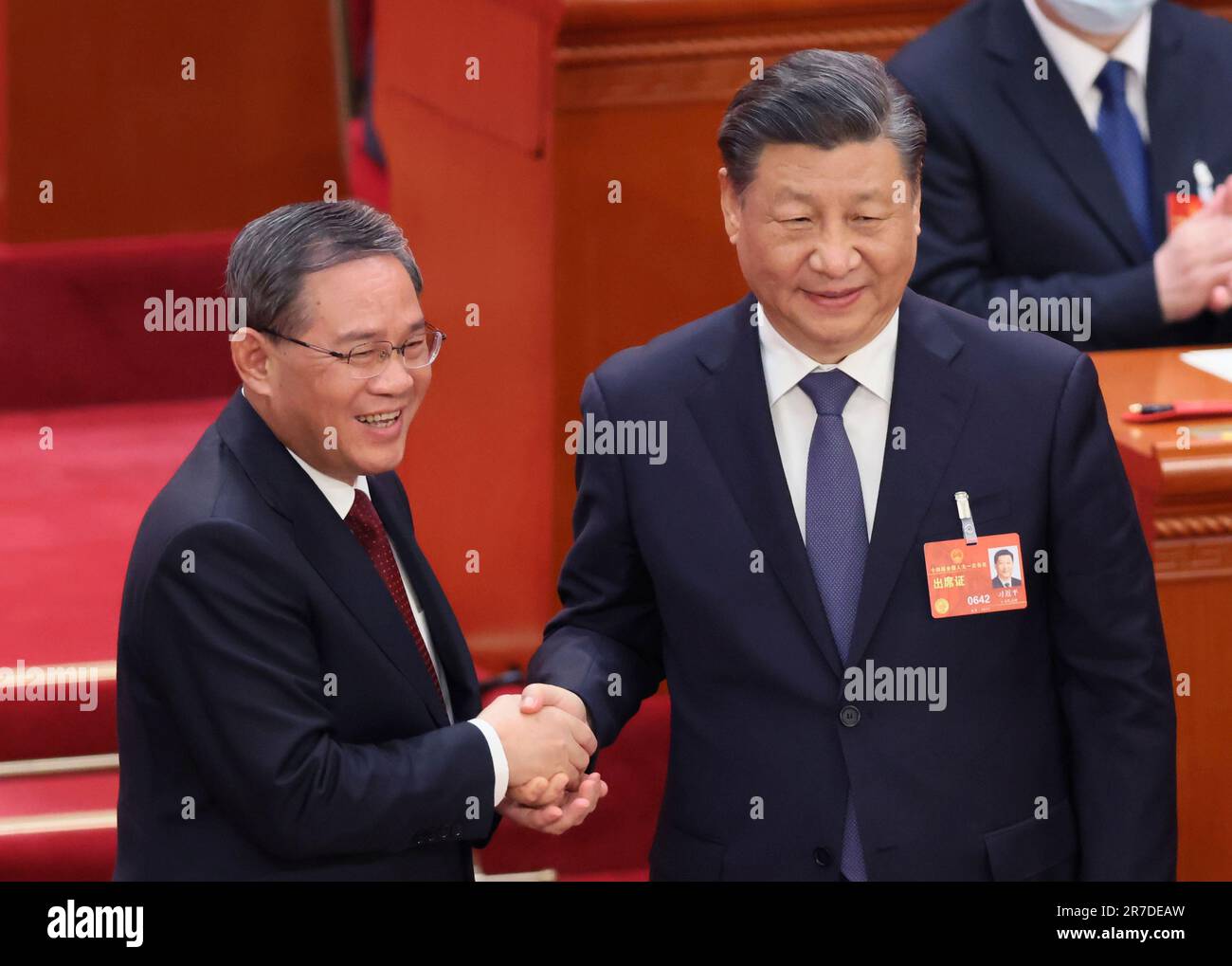 FILE: Chinese President Xi Jinping shakes hands with Li Qiang (L ...